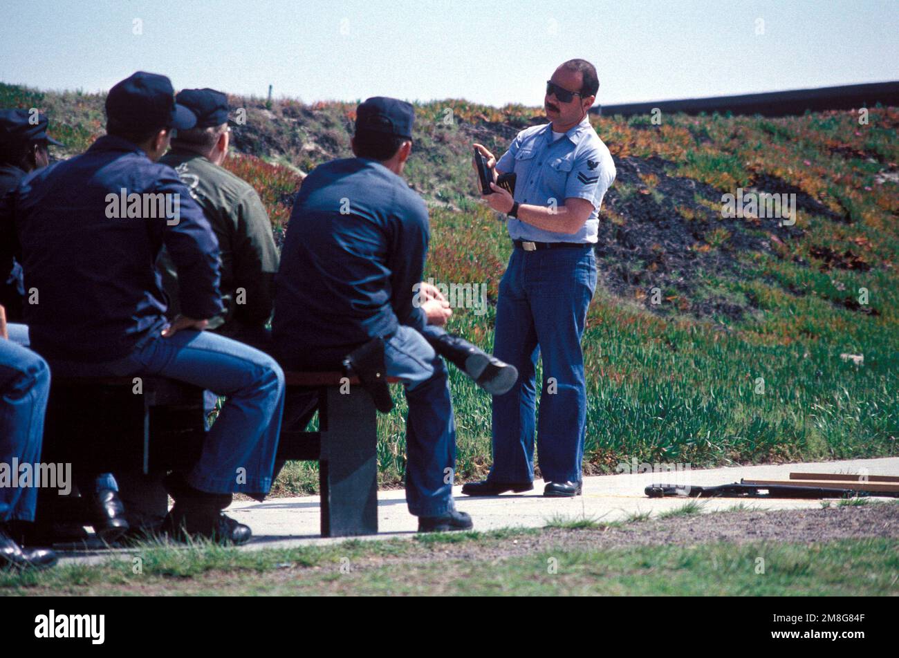 A second class gunners mate (GMG2) is shown instructing Navy personnel ...