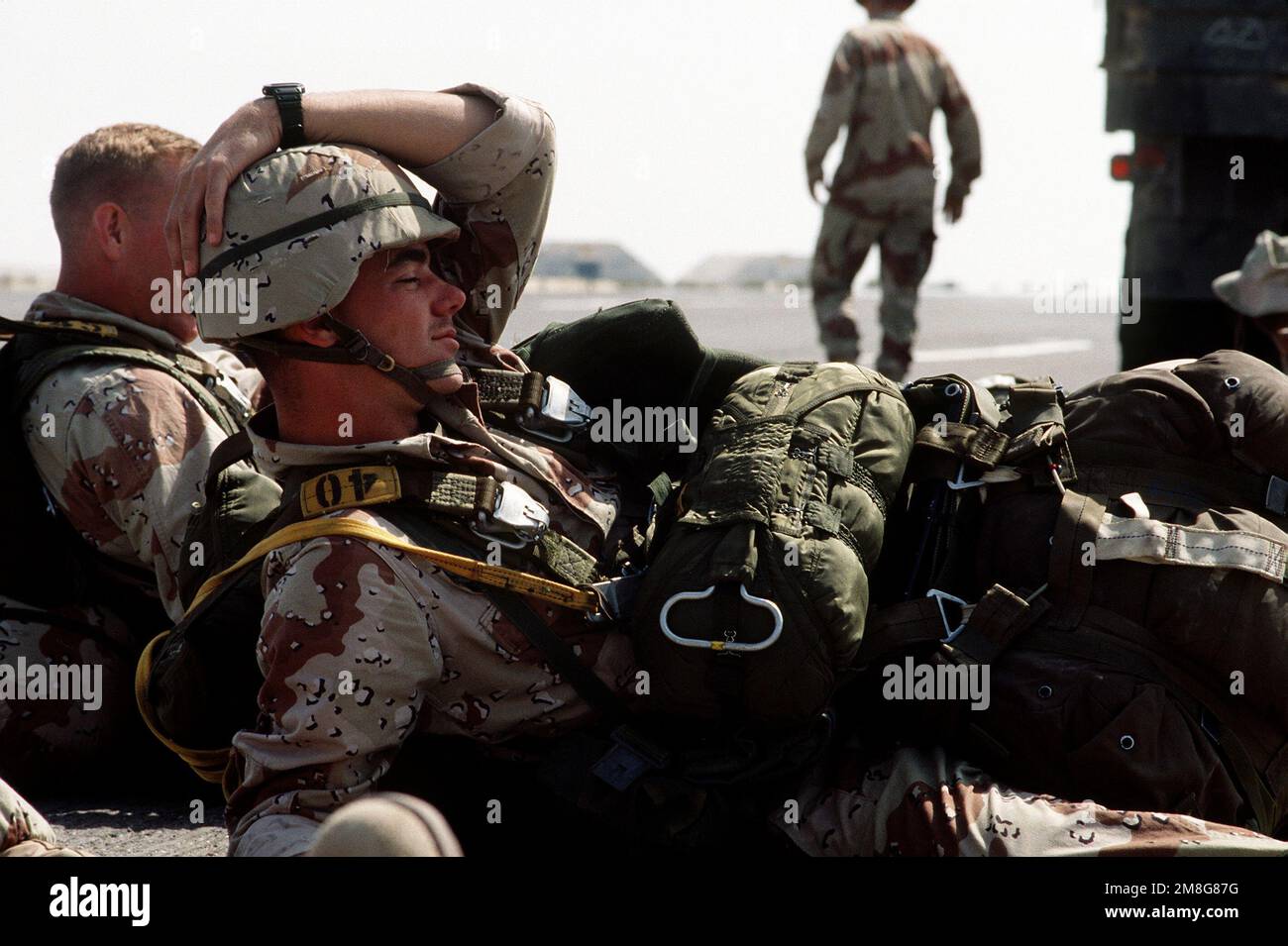 A U.S. paratrooper takes a break prior to a jump during exercise Eager ...