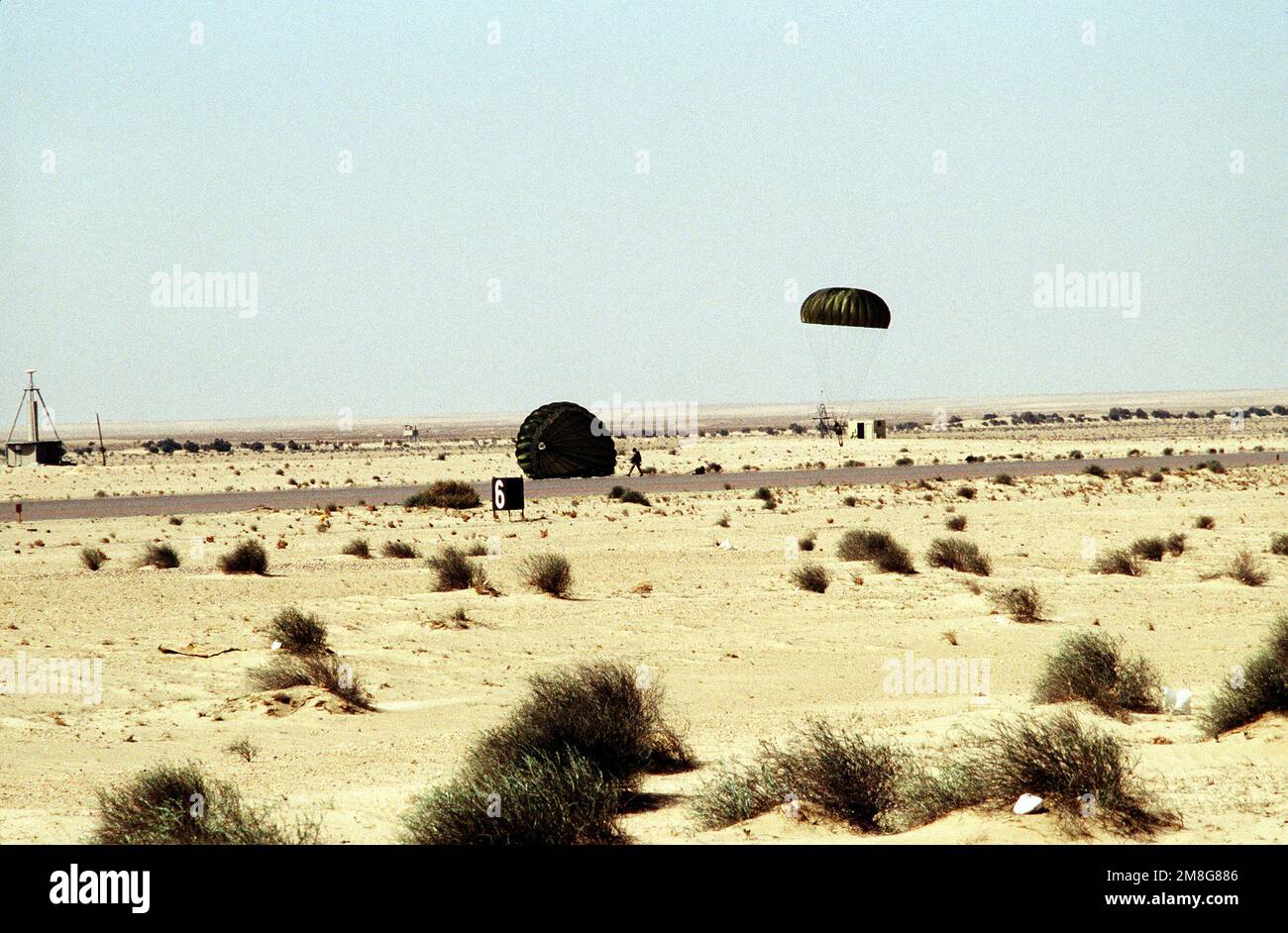 Paratroopers land in a target area during exercise Eager Mace 92-1, the ...