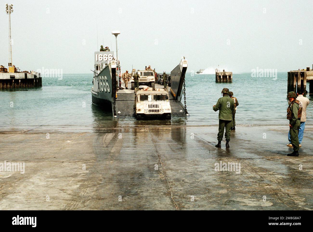 M998 High-Mobility Multipurpose Wheeled Vehicles (HMMWV) are unloaded ...