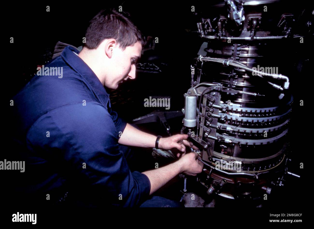 Aviation Machinist's Mate 3rd Class Christopher Pica works on a CH-53 ...