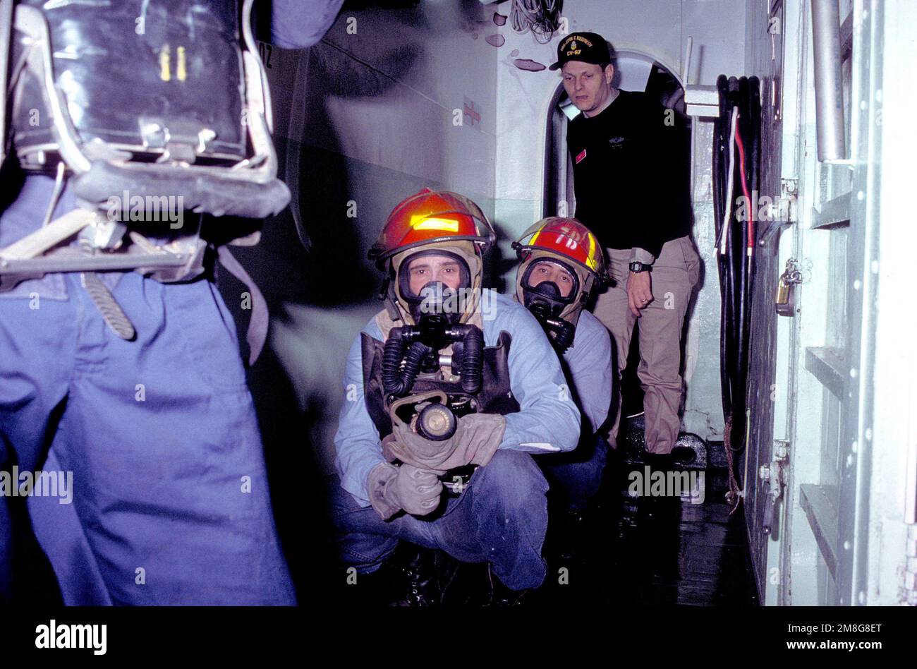 Fireman wearing oxygen breathing apparatus take part in a general ...