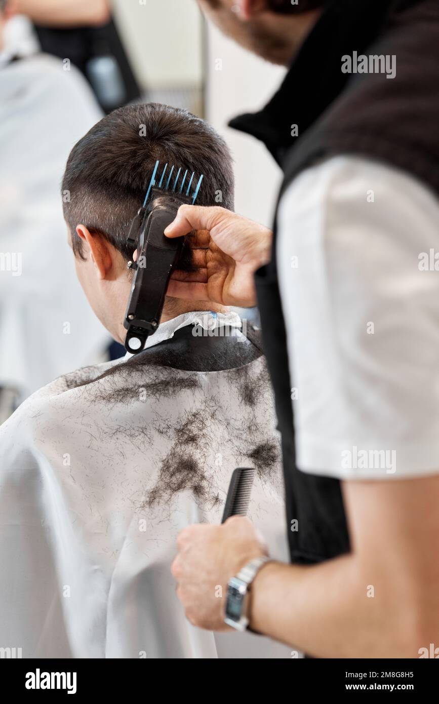 Barber shaving caucasian man in barber shop Stock Photo - Alamy