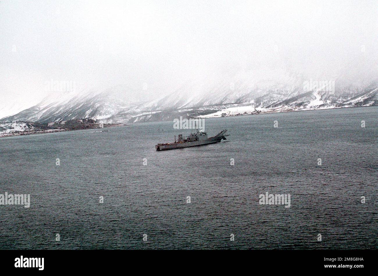 A tank landing ship (LST) approaches the shore during TEAMWORK '92 ...