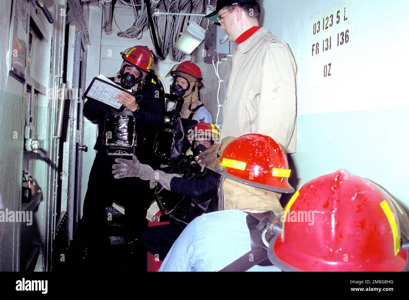 Fireman wearing oxygen breathing apparatus take part in a general ...