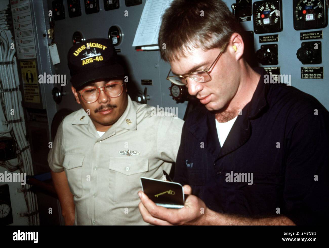 Electrician's Mate 2nd Class Simon receives instruction from CHIEF ...