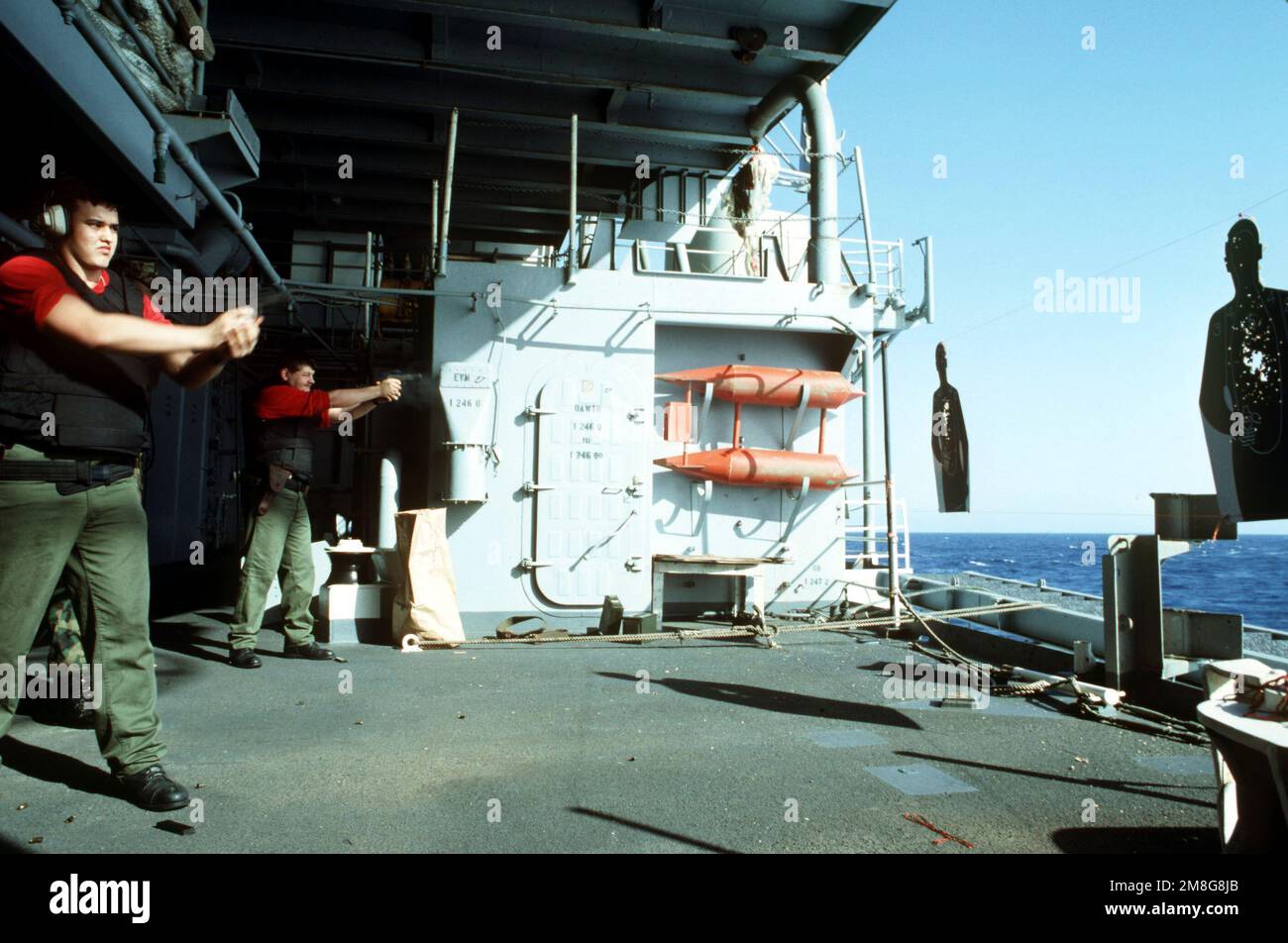 Marines fire M-1911 .45-caliber pistols as they take part in weapons ...