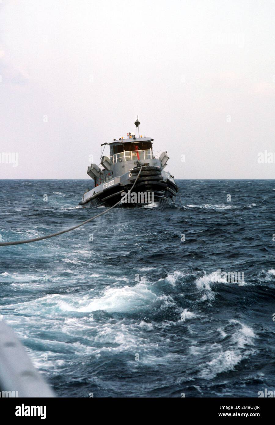 The large harbor tug EUFAULA (YTB-800) is towed by the salvage ship USS ...