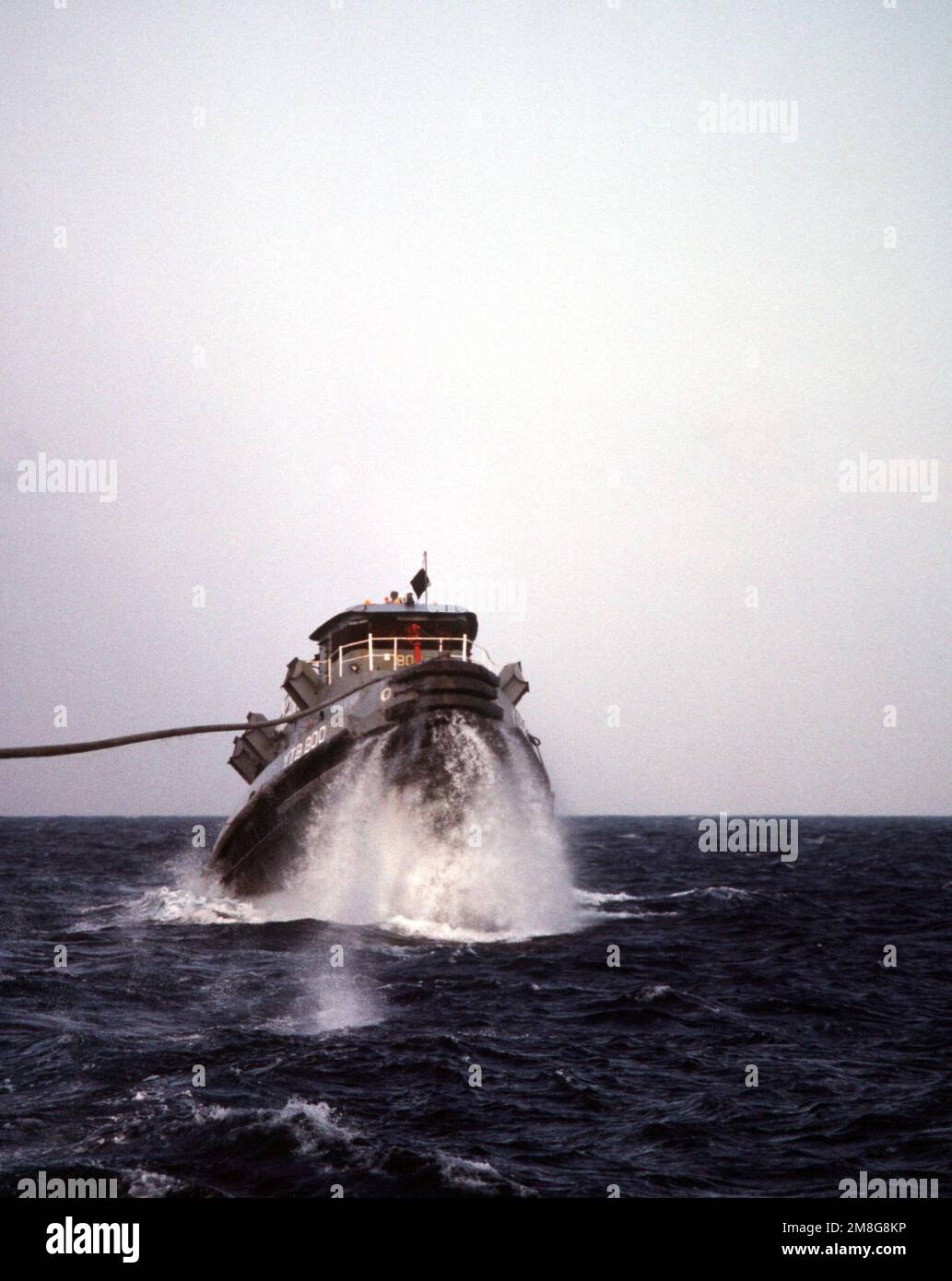 The large harbor tug EUFAULA (YTB-800) is towed by the salvage ship USS ...