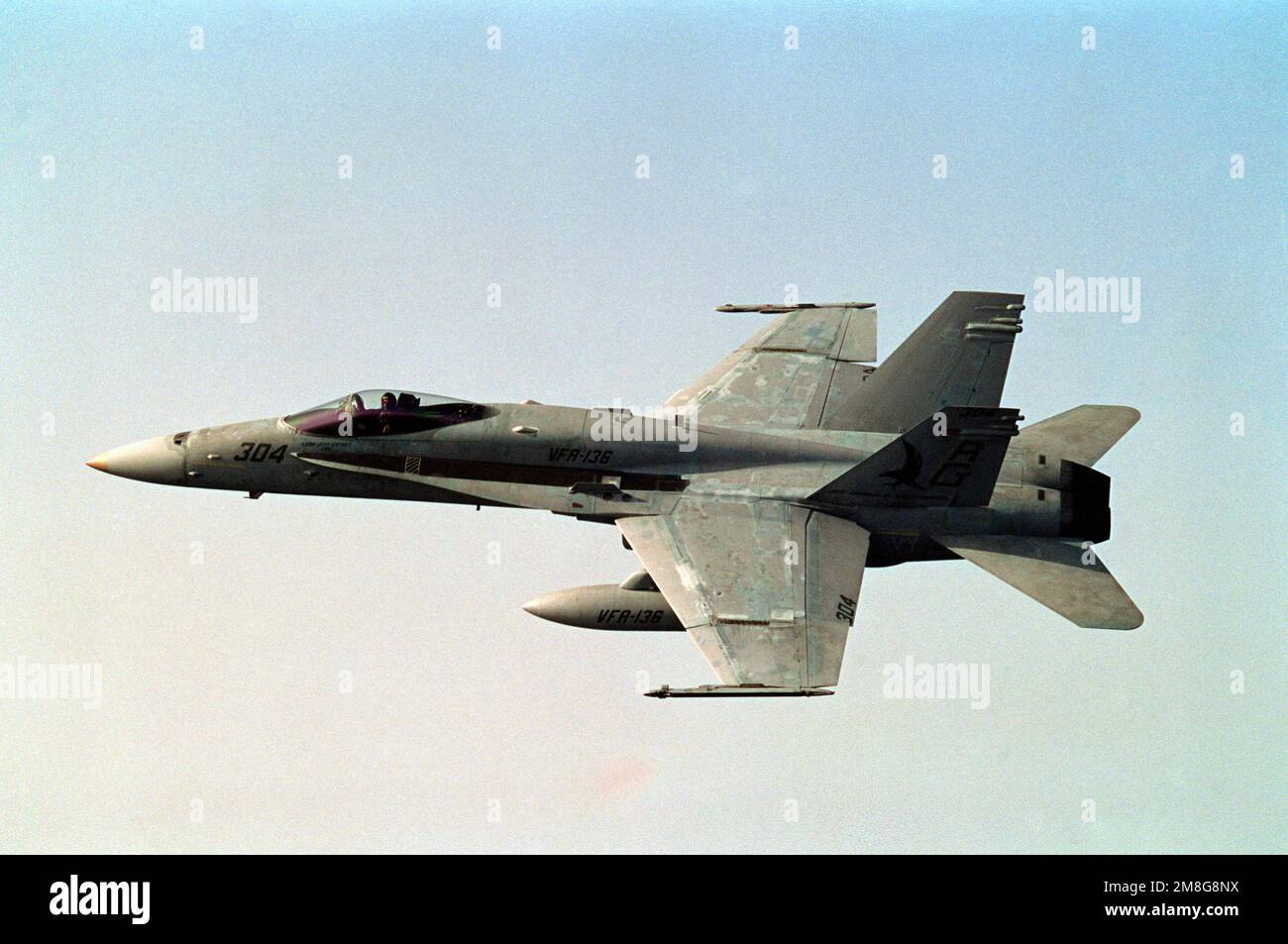 An air-to-air left side view of Strike Fighter Squadron 136 (VFA-136) F ...