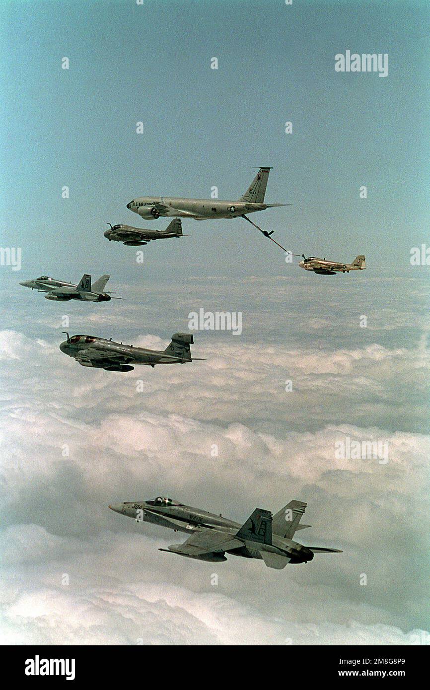 A KC-135D Stratotanker aircraft refuels a KA-6D Intruder aircraft as an ...