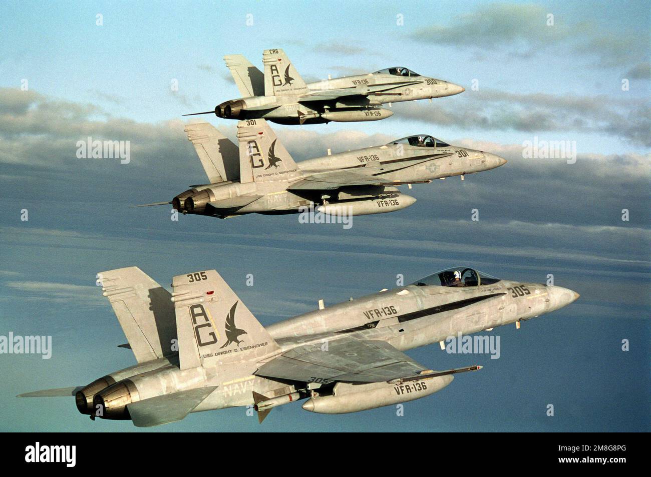An air-to-air right side view of Strike Fighter Squadron 136 (VFA-136 ...