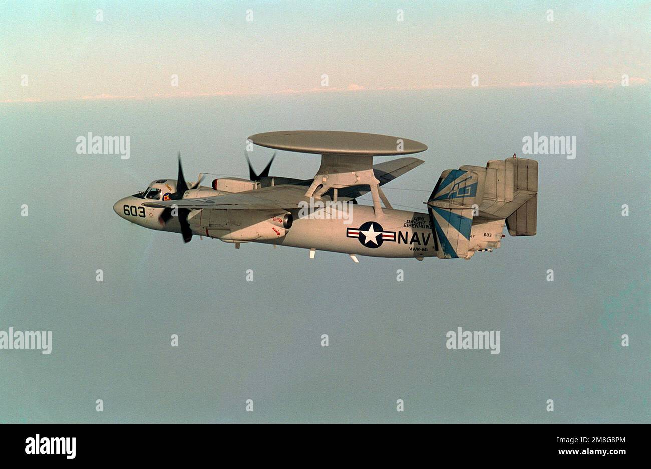 An air-to-air left side view of an Airborne Early Warning Squadron 121 ...
