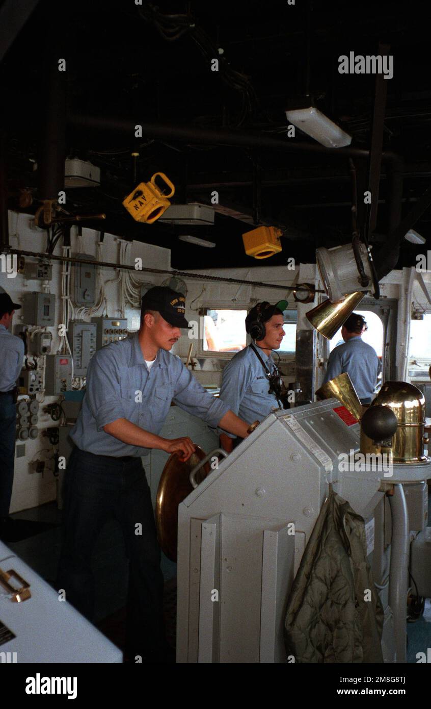 Crewmen on the bridge of the guided missile cruiser USS ENGLAND (CG-22 ...