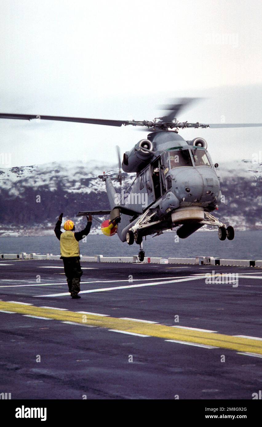 An SH-2F Seasprite anti-submarine warfare helicopter lands aboard the ...