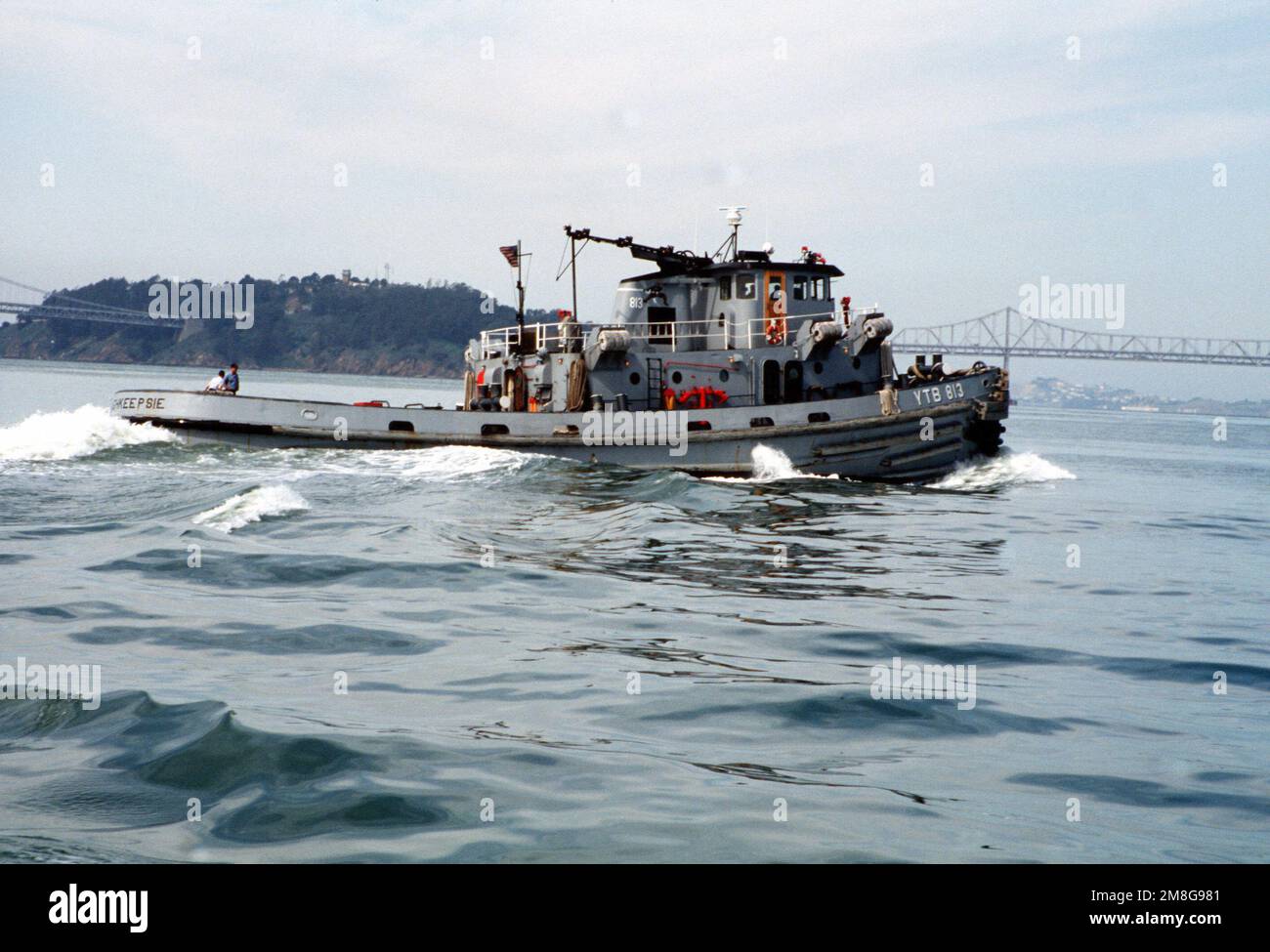 A starboard beam view of the large harbor tug POUGHKEEPSIE (YTB-813)as ...