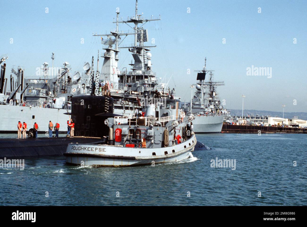 The large harbor tug POUGHKEEPSIE (YTB-813) comes alongside the nuclear ...