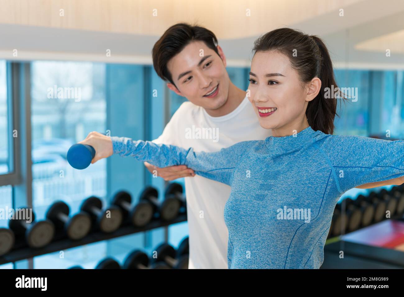 A young woman in private teaching under the guidance of fitness Stock ...