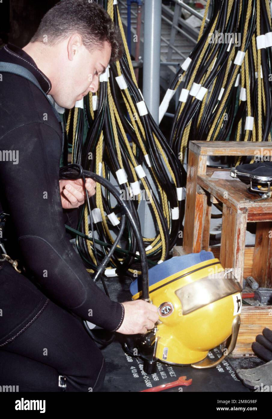 A diver from the Shore Intermediate Maintenance Activity (SIMA ...