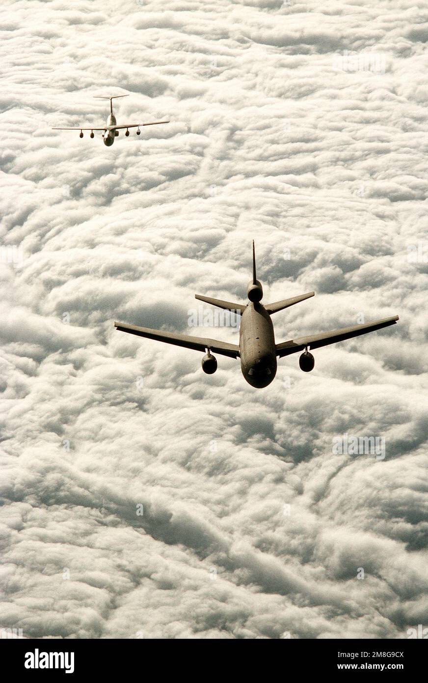 A 7th Airlift Squadron (7th AS) C-141B Starlifter aircraft follows a ...