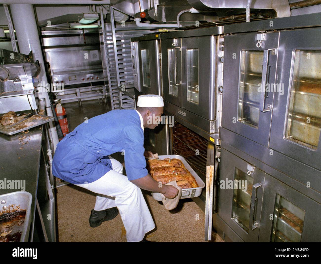 Mess Management SPECIALIST 3rd Class Williams removes meatloaf from an ...