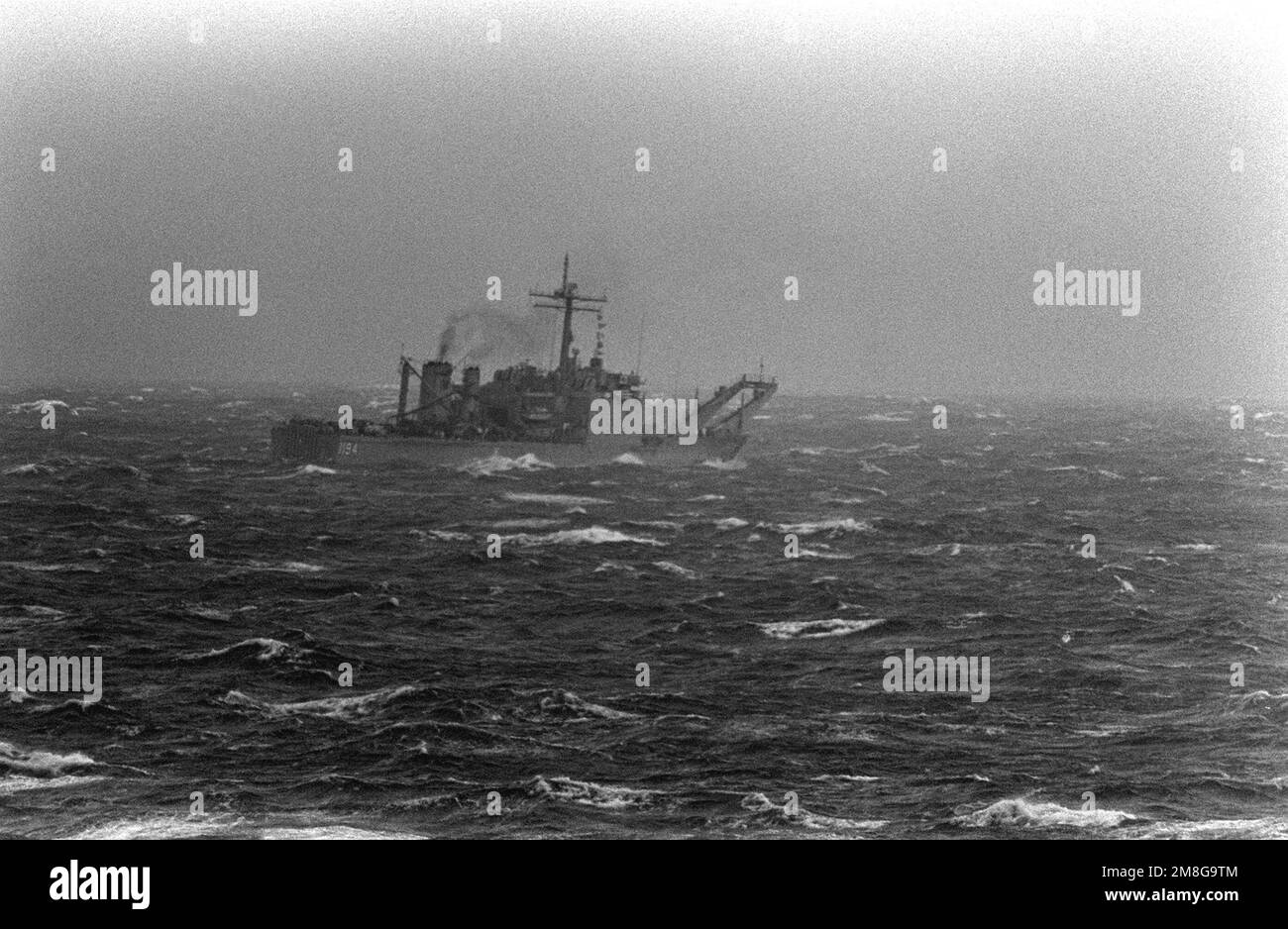 A starboard quarter view of the tank landing ship USS LAMOURE COUNTY ...
