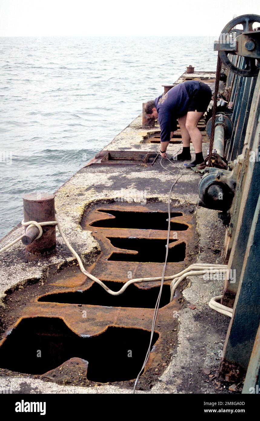 A member of the Explosive Ordnance Disposal (EOD) team of the Naval ...