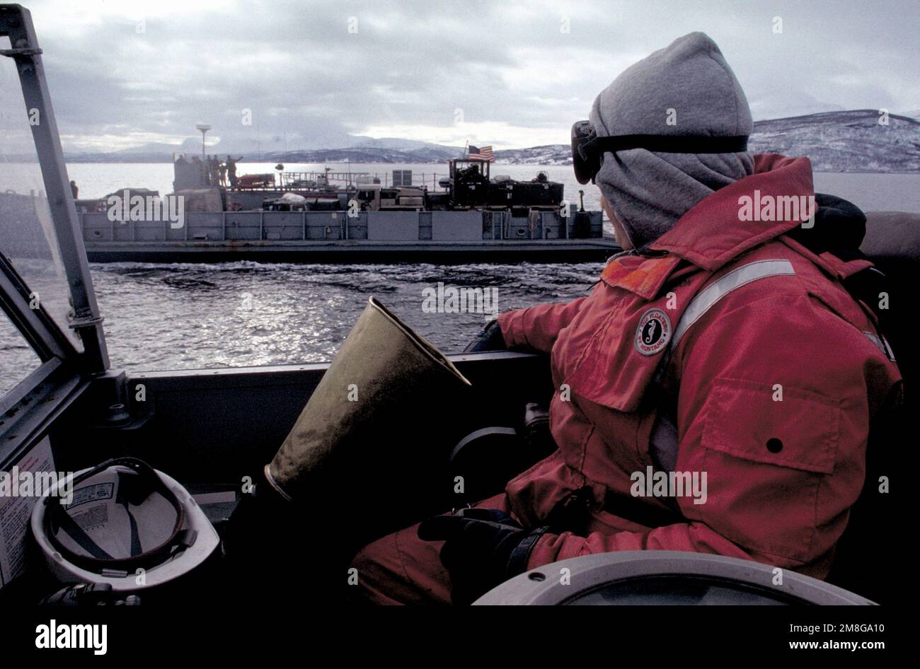 MASTER CHIEF Boatswain's Mate John Fisher, at the controls of utility ...