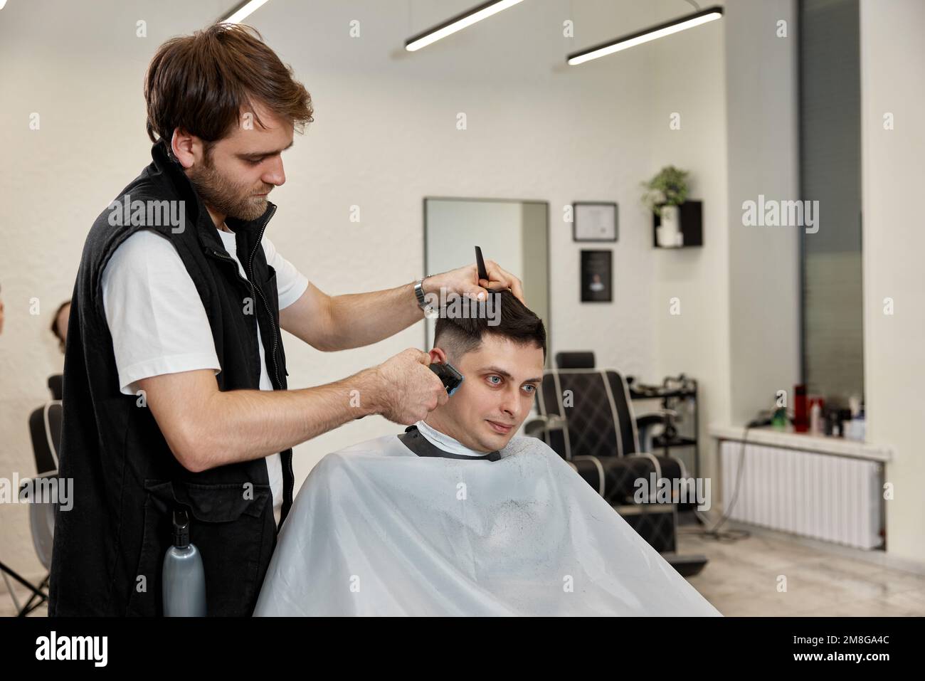 Barber hands shaving beard trimmer hi-res stock photography and images ...