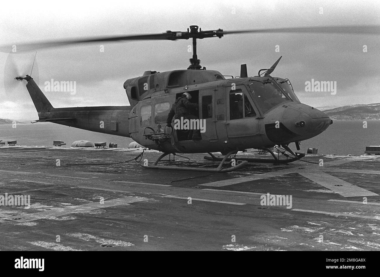 A UH-1N Iroquois "Huey" helicopter warms up its engines on the flight ...