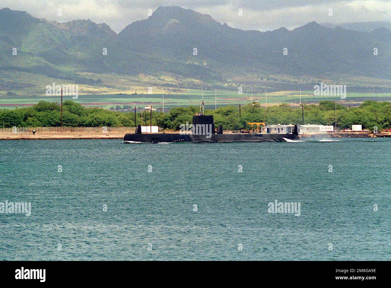 A port bow view of the submarine USS DARTER (SS-576) departing Pearl ...