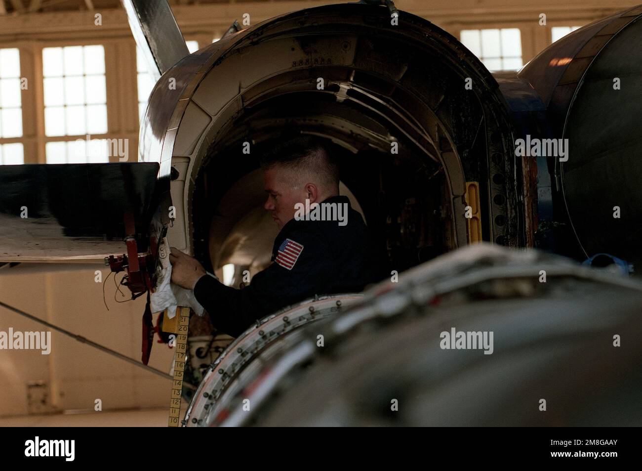A crewman for the Blue Angels, the Navy flight demonstration squadron ...