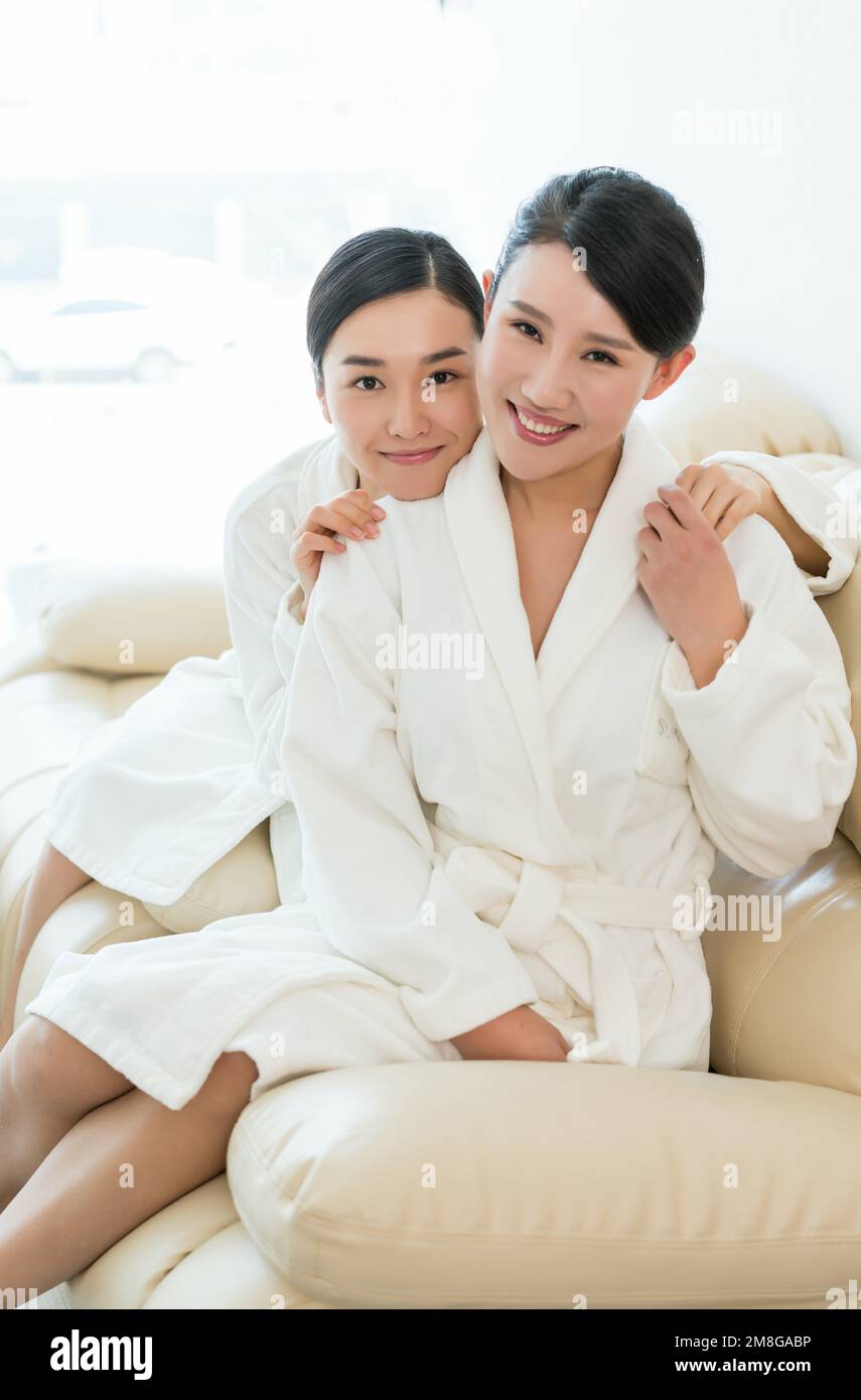 Mother and daughter two people wearing a bathrobe Stock Photo - Alamy