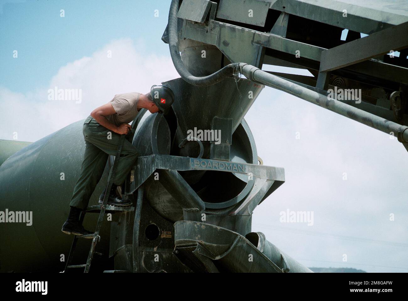 Navy Seabees from Navy Mobile Construction Battalion Four (NMCB-4) pour ...