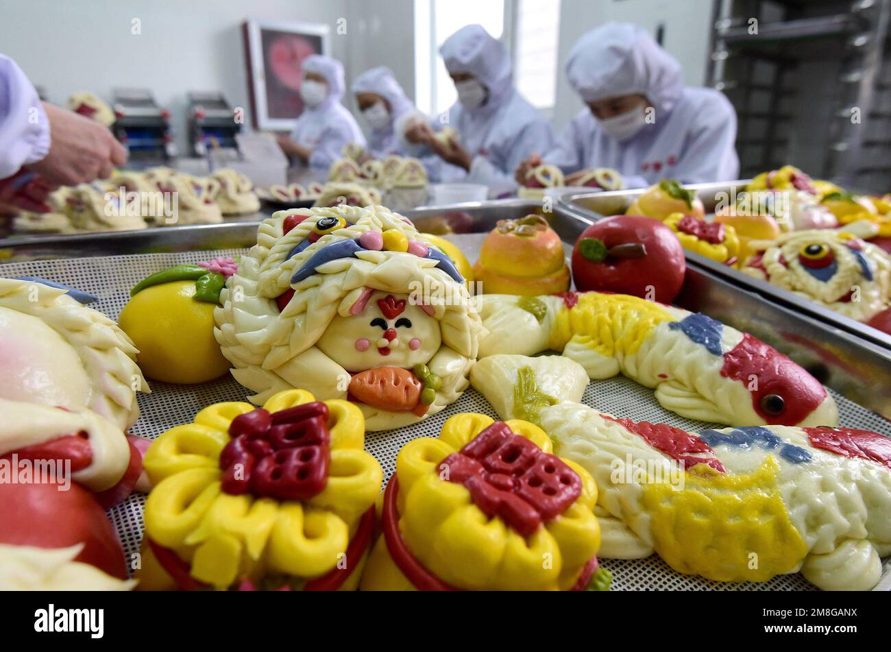 HANDAN, CHINA - JANUARY 14, 2023 - Workers make rabbit-themed steamed ...