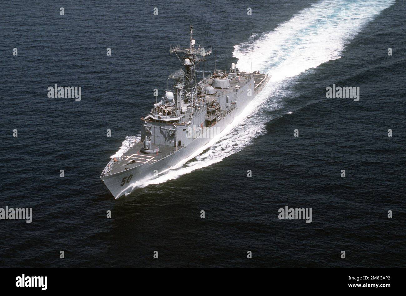 A port bow view of the guided missile frigate USS TAYLOR (FFG-50) after ...