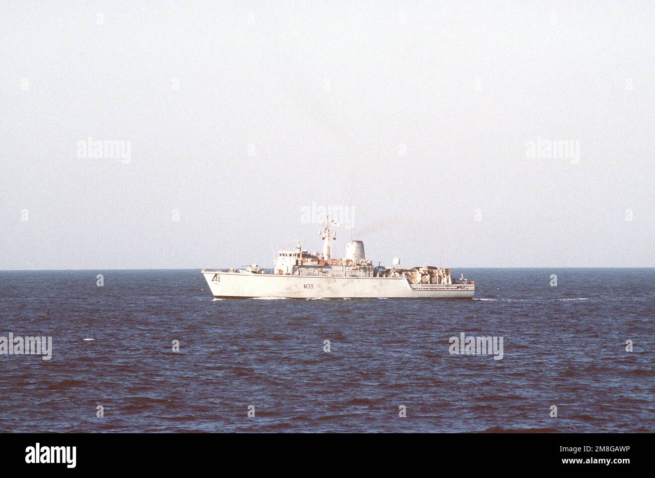 A port beam view of the British ocean minesweeper HMS HURWORTH (M-39 ...