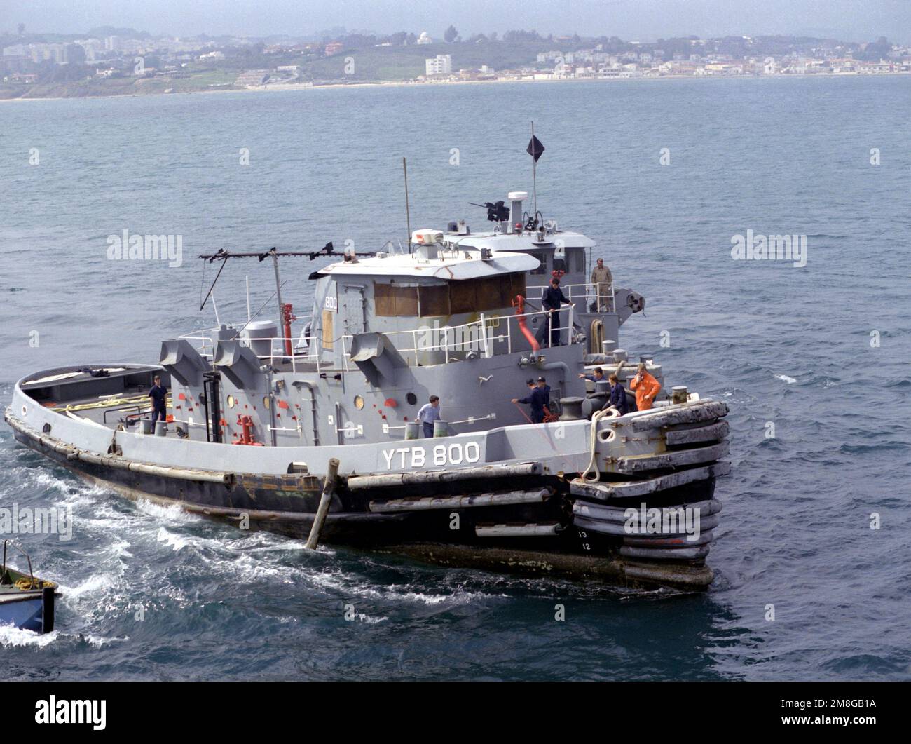 The large harbor tug EUFAULA (YTB-800) is moved into position over the ...