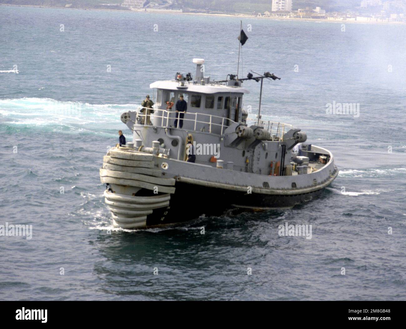 A large harbor tug moves into position to be loaded aboard the Dutch ...