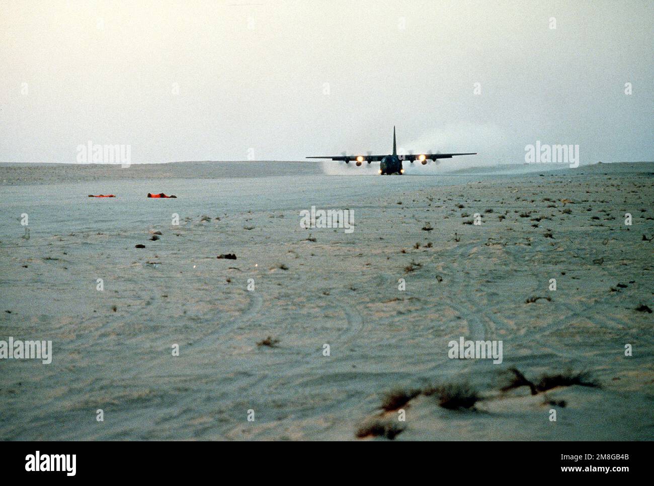 A 314th Tactical Air Wing C-130E Hercules aircraft touches down while ...