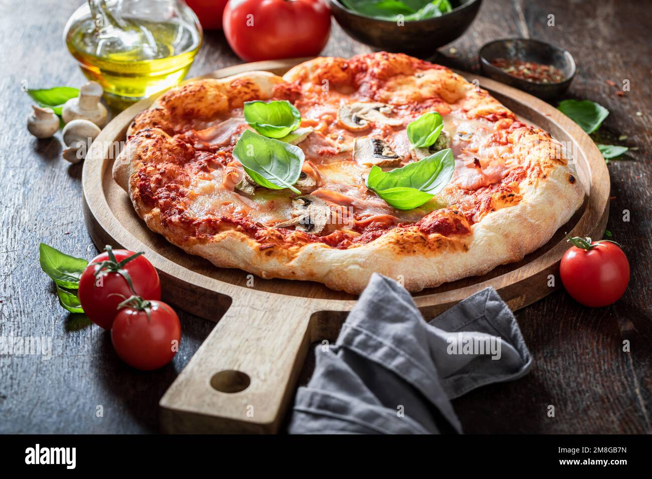 Spicy Capricciosa pizza made of ham and mushrooms. Classic Italian ...