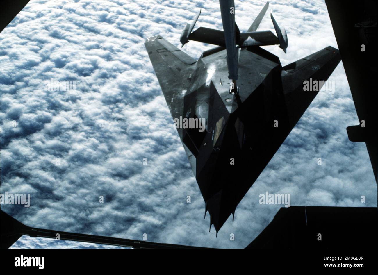 A 37th Tactical Fighter Wing F-117A stealth fighter aircraft refuels ...