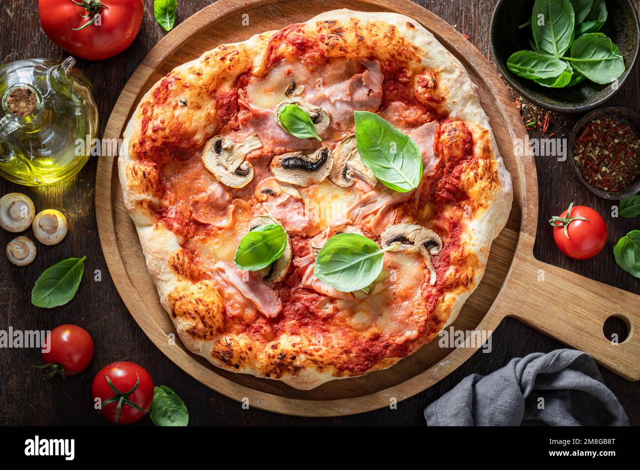 Traditional Capricciosa pizza with cheese, ham and mushrooms. Classic ...