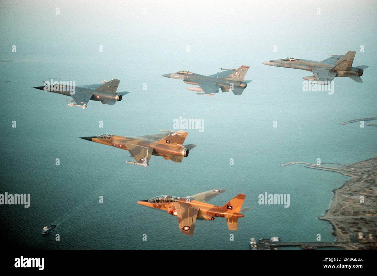 An air-to-air view of a multinational group of fighter jets, including ...