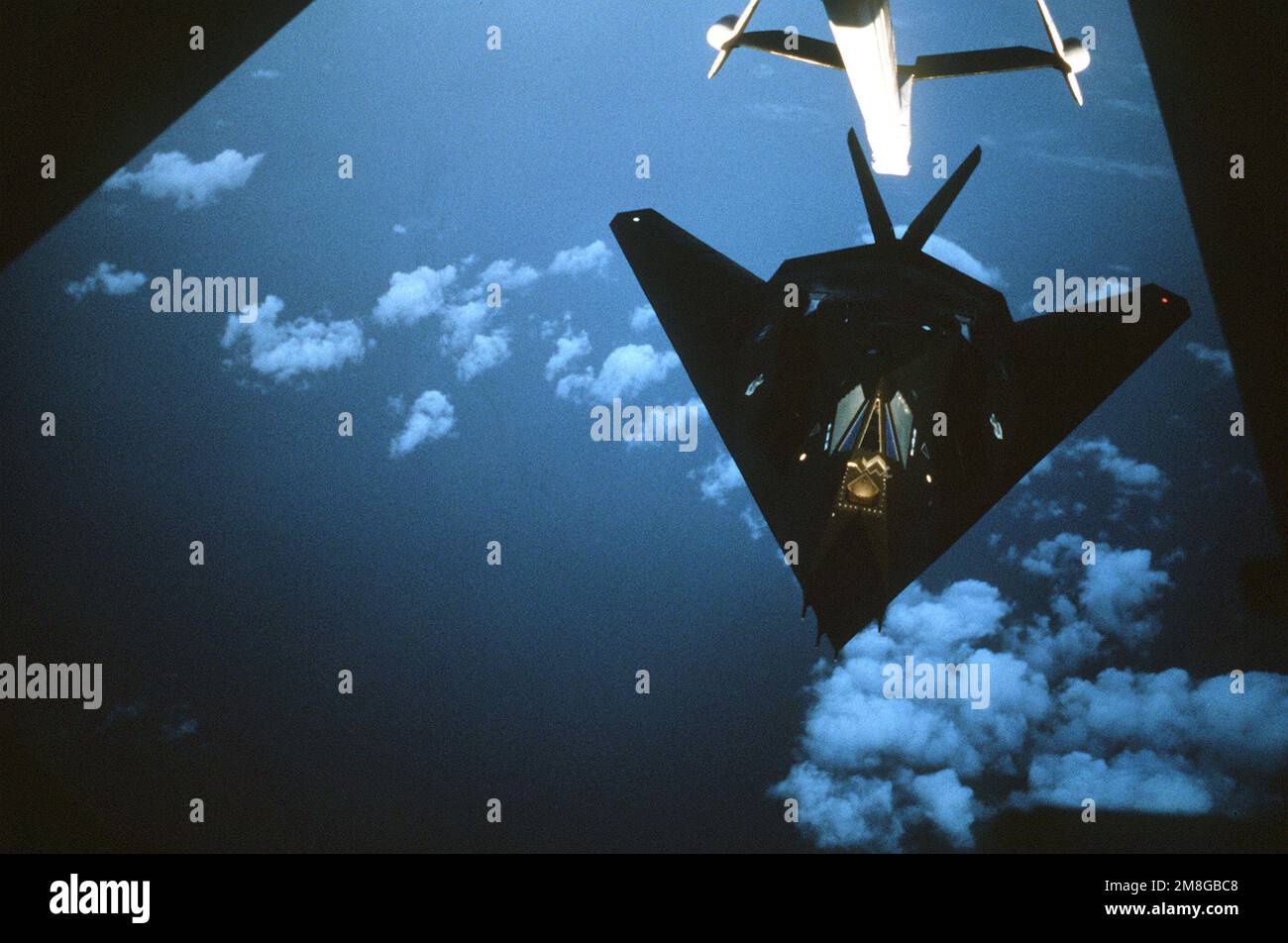 A 37th Tactical Fighter Wing F-117A Stealth fighter aircraft refuels ...