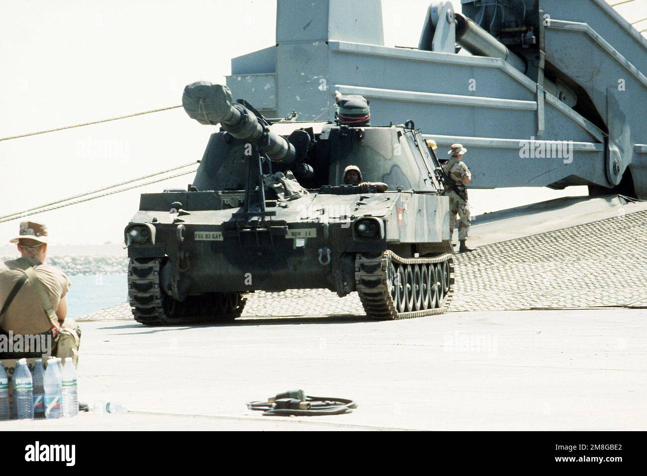 An M-109 155mm self-propelled howitzer is offloaded from a vehicle ...