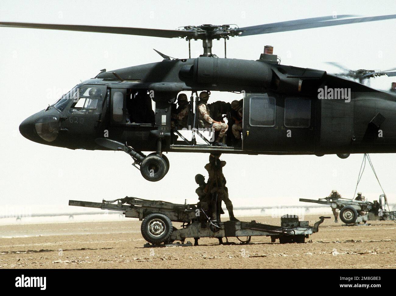 Members of C Btry., 1ST Bn., 319th Air Field Arty. Regt., secure M-102 ...