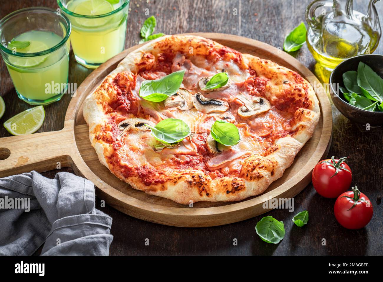 Traditional Capricciosa pizza on wooden table. Classic Italian cuisine ...
