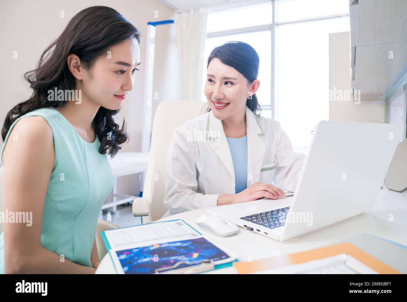 Professional reception young woman Stock Photo - Alamy