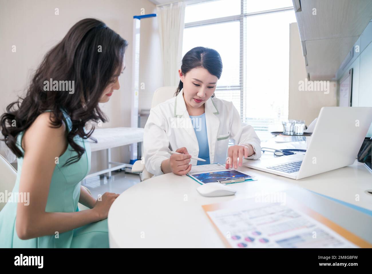 Professional reception young woman Stock Photo - Alamy